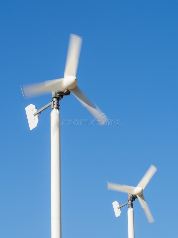 Small Wind Turbines with Clear Blue Sky (motion Blur) Stock Photo ...