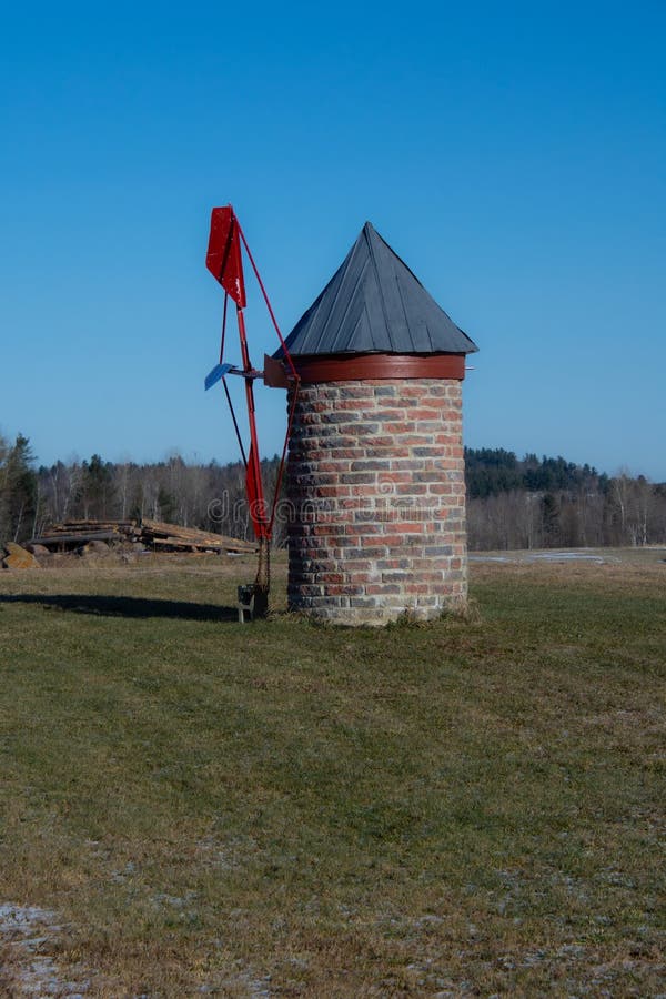 Small windmill in a field stock image. Image of canada - 236199739