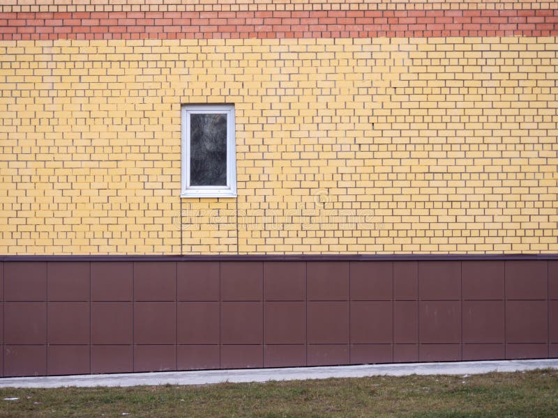 A Small Window in a Brick Wall. Colored Bricks Stock Photo - Image of ...