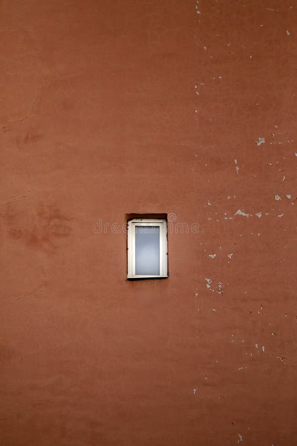 A Small Window in a Large Wall on the Facade of a Red Building Stock ...
