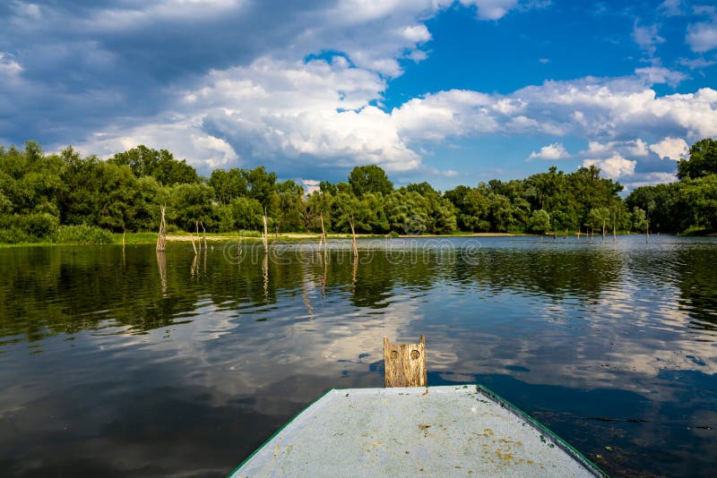 Small Boat on the Calm Lake Stock Photo - Image of lake, wooden: 206661942