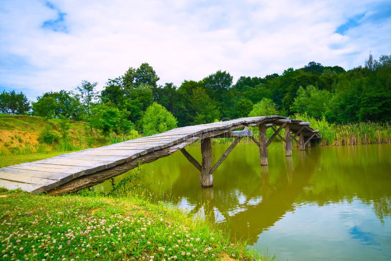 A Small Wooden Bridge Across a River Stock Image - Image of forest ...