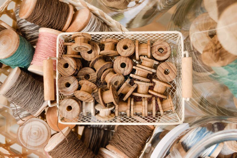 Small Wooden Coils in a Basket and Big Coils with Colorful Threads ...