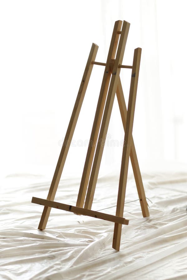 A Small Wooden Easel in an Interior Stock Photo - Image of line, iron ...