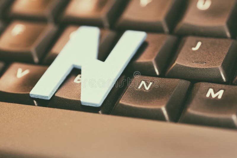 Small Wooden Letter `N` on Black Computer Keyboard Stock Photo - Image ...