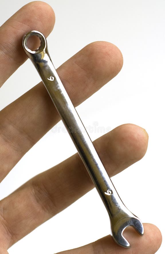 Small wrench on a hand stock photo. Image of wrench, effort - 10699470