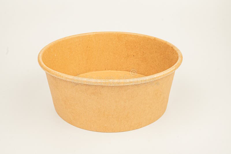 A Small, Yellow or Beige Ceramic Bowl with a Smooth Matte Finish ...