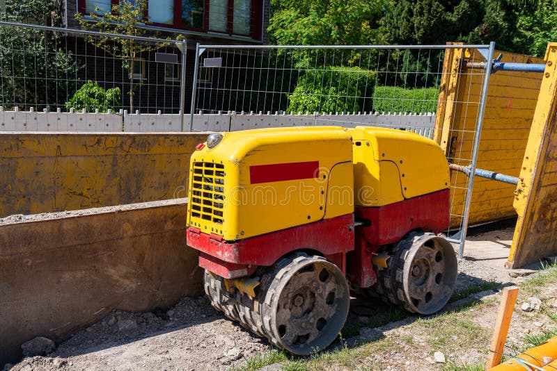 Small Yellow Construction Roller for Compacting Soil at a Construction ...