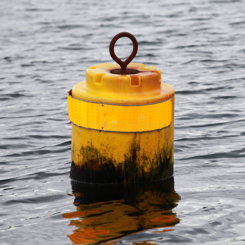 Small Yellow Cylindrical Buoy Stock Image - Image of industrial, border ...