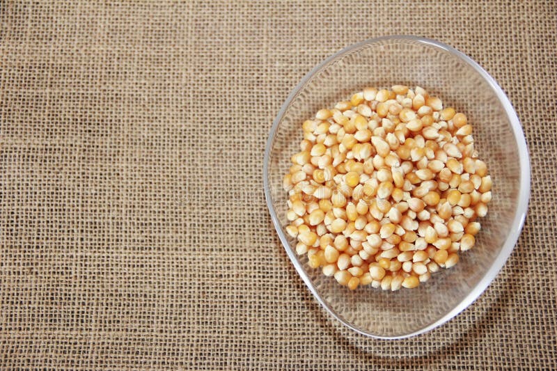 Small Yellow Dry Grains of Natural Corn in a Decorative Plate on Brown ...