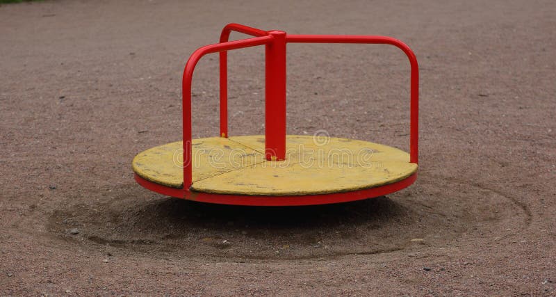 Small Yellow-red Carousel on the Playground Stock Image - Image of ...