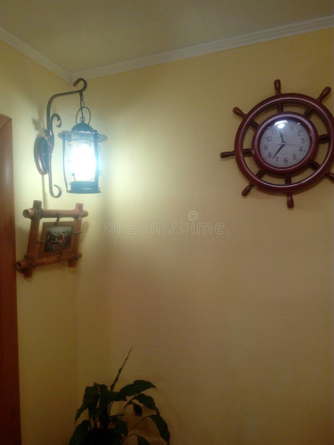 Small Yellow Room in the Evening. Clock, Lantern, Flower. Stock Photo ...
