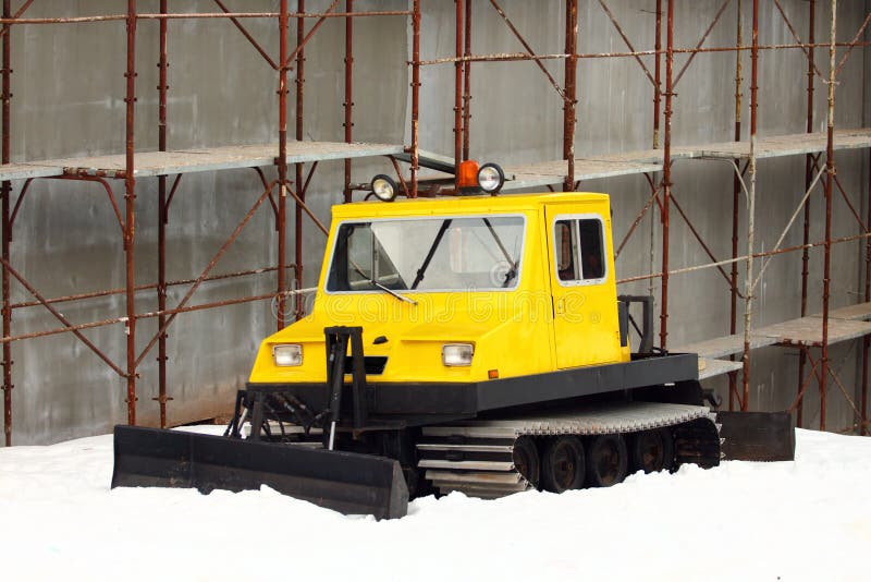 A Small Snowcat in the Parking Lot while Snowing in Alps Switzerland ...
