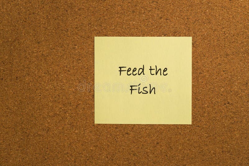 Small Yellow Sticky Note on Office Noticeboard Stock Photo - Image of ...