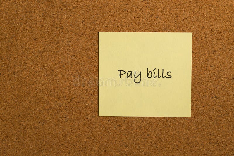 Small Yellow Sticky Note on Office Noticeboard Stock Photo - Image of ...