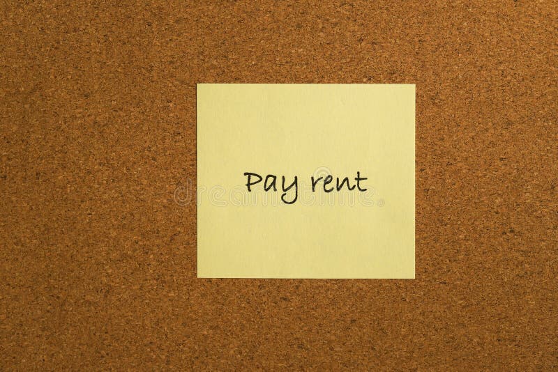 Small Yellow Sticky Note on Office Noticeboard Stock Photo - Image of ...