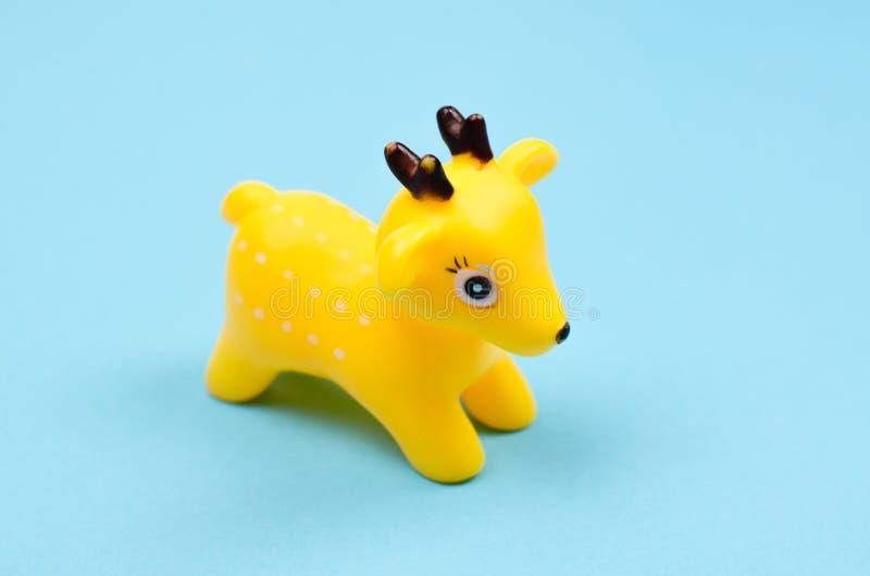 Small yellow toy deer stock image. Image of cute, small - 207722071