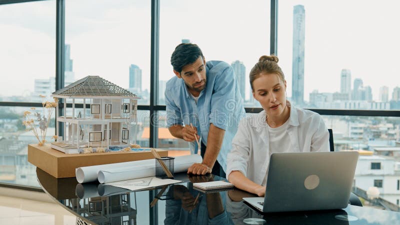 Smart Engineer Inspect House Model while Colleague Using Laptop ...