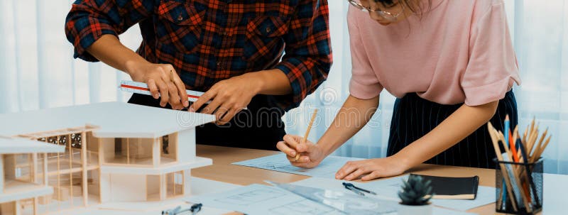 Smart Architect Engineer Working Together and Measuring House Model ...
