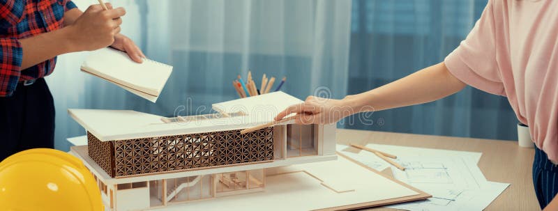Smart Architect Engineer Working Together and Measuring House Model ...