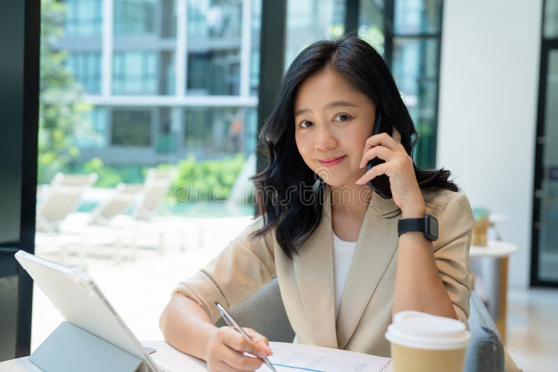 Smart Asian Woman Startup Using Smartphone while Working on Desk. she ...