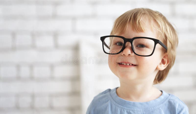 Smart boy with big glasses stock photo. Image of glasses - 264072554