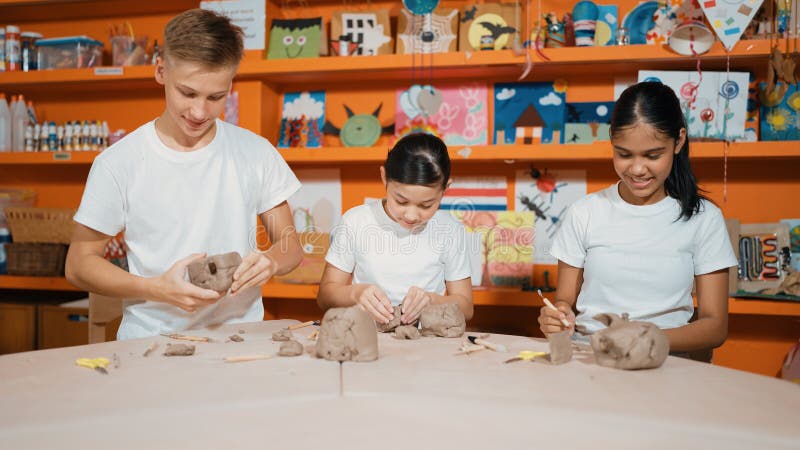 Smart Boy Modeling Cup of Clay with Friend at Pottery Workshop ...