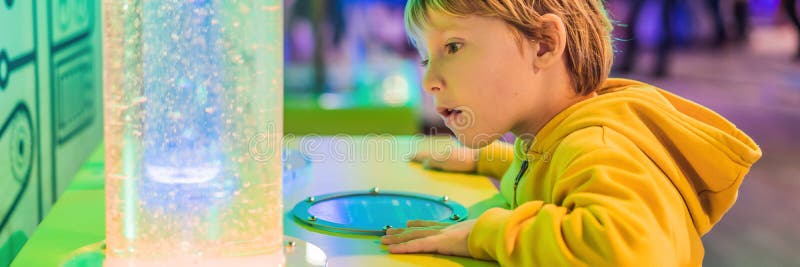 Smart Boy Scientist Making Physical Experiments in the Laboratory ...