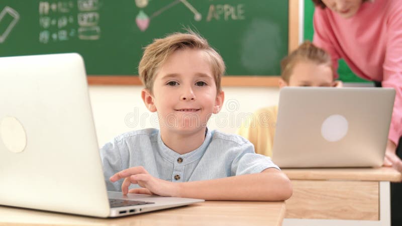 Smart Boy Working at Laptop while Diverse Children Programing System ...