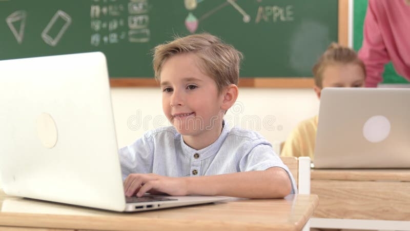 Smart Boy Working at Laptop while Diverse Children Programing System ...