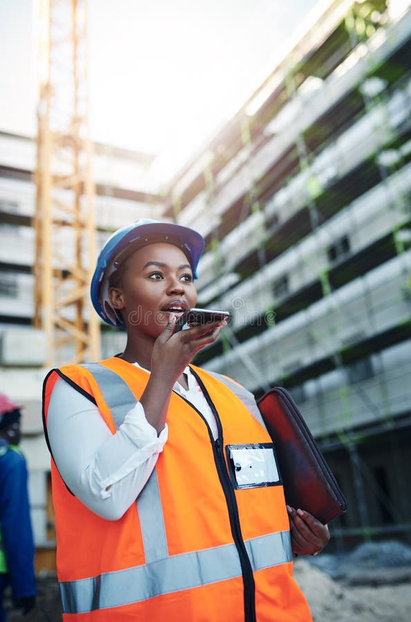 A Smart Building Contractor Uses Smart Tools. a Young Woman Using a ...