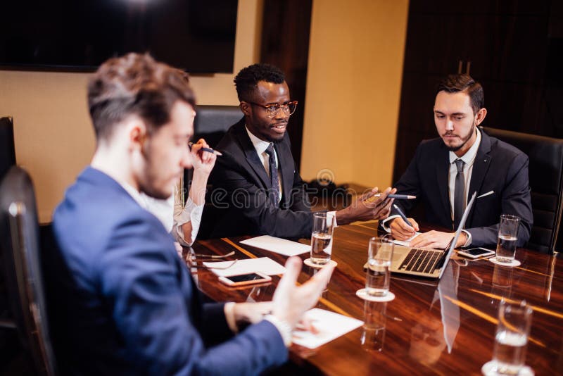 Smart Business Partners Using Laptop at Meeting Stock Photo - Image of ...