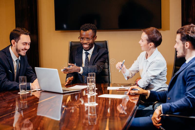 Smart Business Partners Using Laptop at Meeting Stock Photo - Image of ...