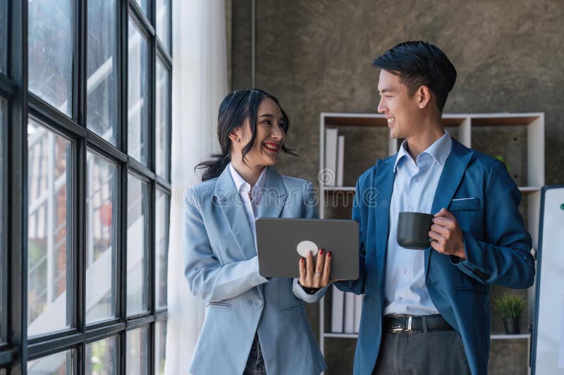 Smart Business People Working Together with Tablet while Talking in the ...