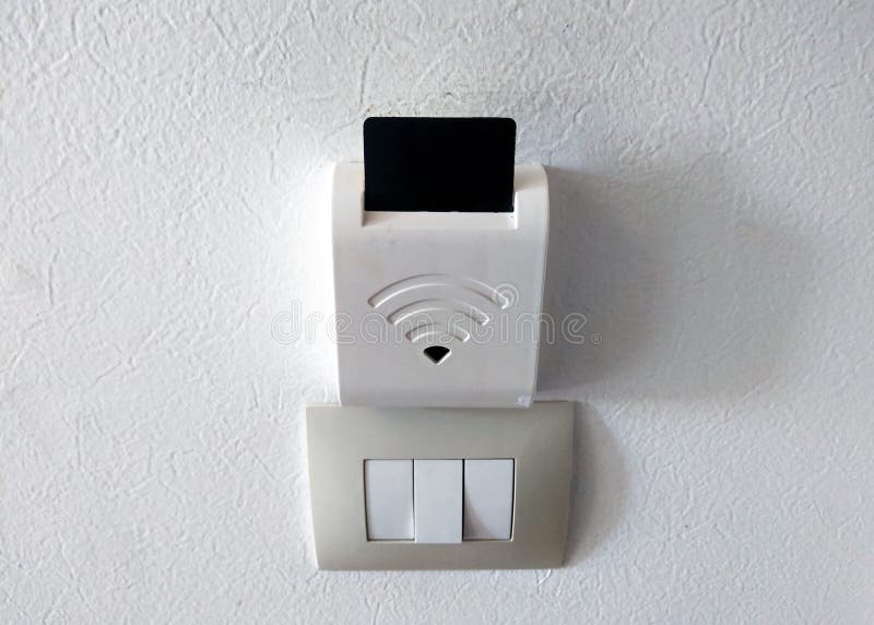 Smart Card Reader and Light Switch on Textured Wall for Modern Access ...