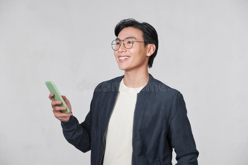 Smart Casual Asian Man Using Smartphone in Studio Background Stock ...