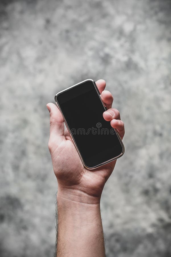 Smart cell phone in hand stock photo. Image of display - 212201474