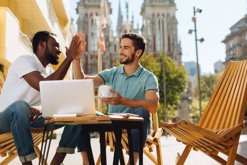 Smart Cheerful Guy Giving His Friend a High Five Stock Photo - Image of ...