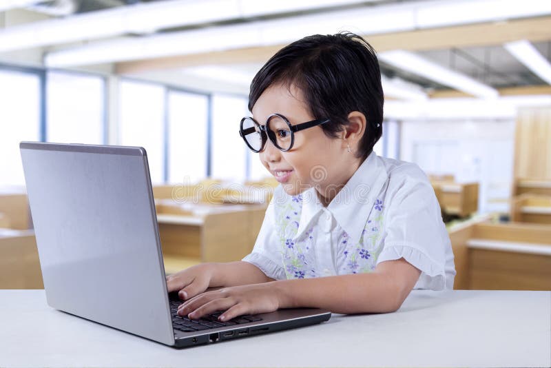 Smart Child Typing on Laptop in the Class Stock Image - Image of ...