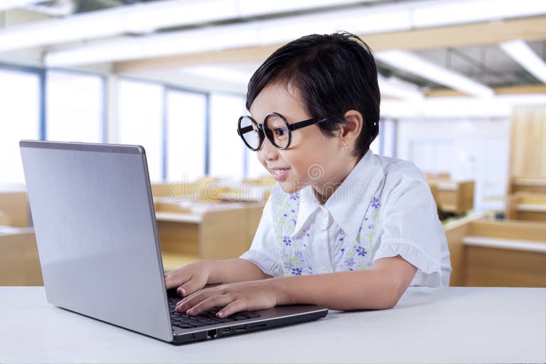Smart Child Typing on Laptop in the Class Stock Image - Image of ...