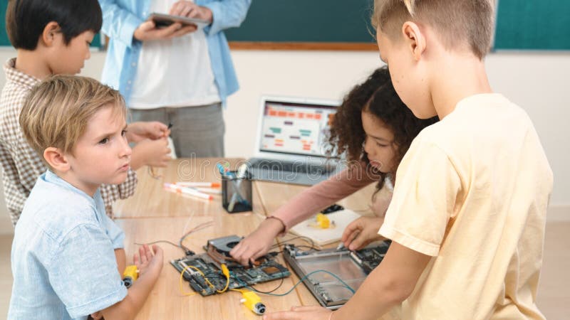 Smart Children Working on Electronic Board while Teacher Using Tablet. Pedagogy. Stock Photo ...