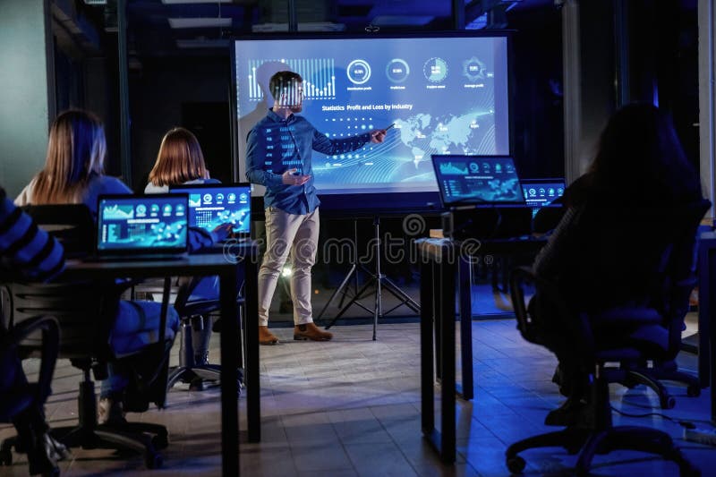 Smart Coach. Male Business Trainer is Against Projector with Data ...