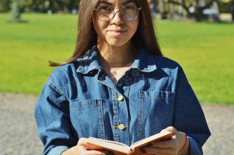 Smart College Student with Glasses Reading a Book Stock Image - Image ...