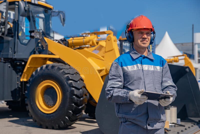 Smart Construction Site, Foreman in Helmet Controls Equipment Using ...