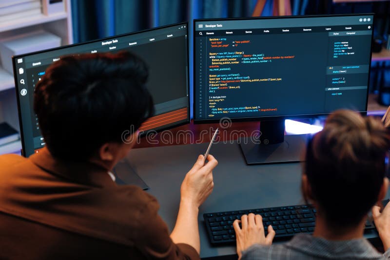 Smart It Developer Looking At Coding Program Application At Back Side