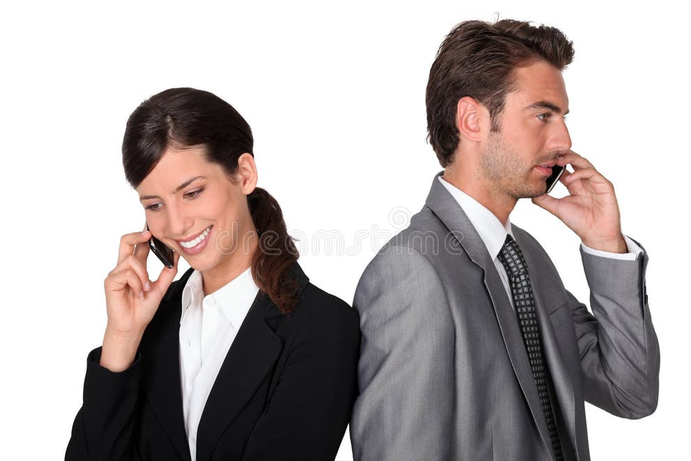Smart duo on cell phone stock photo. Image of note, coat - 22536668