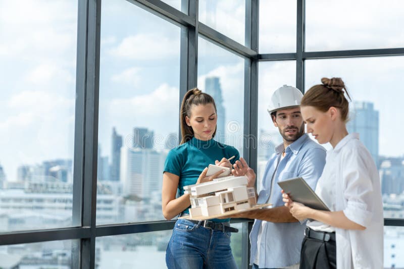 Smart Engineer Holds House Model and Explain about House Construction ... Smart Engineer Holds House Model and Explain about House Construction ...