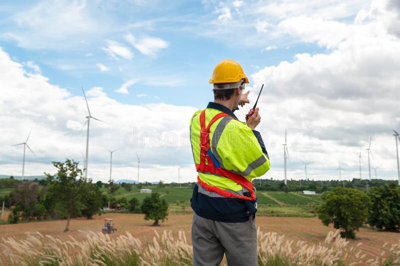 Smart Engineer with Protective Helmet on Head, Using Walkie Talkie at ...