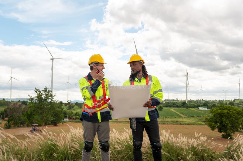 Smart Engineers with Protective Helmet Shaking Hands at Electrical ...