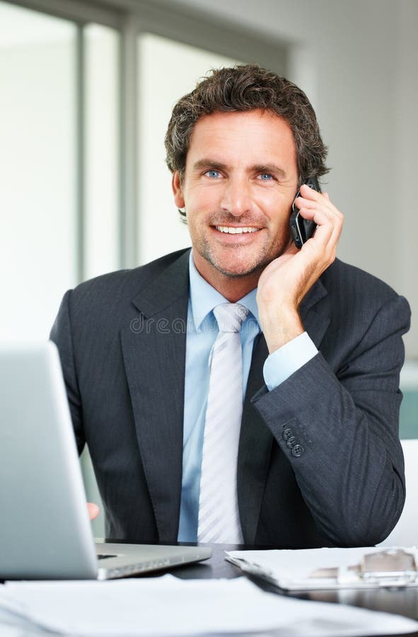 Smart Executive Talking on Cellphone. Mature Executive Talking on ...